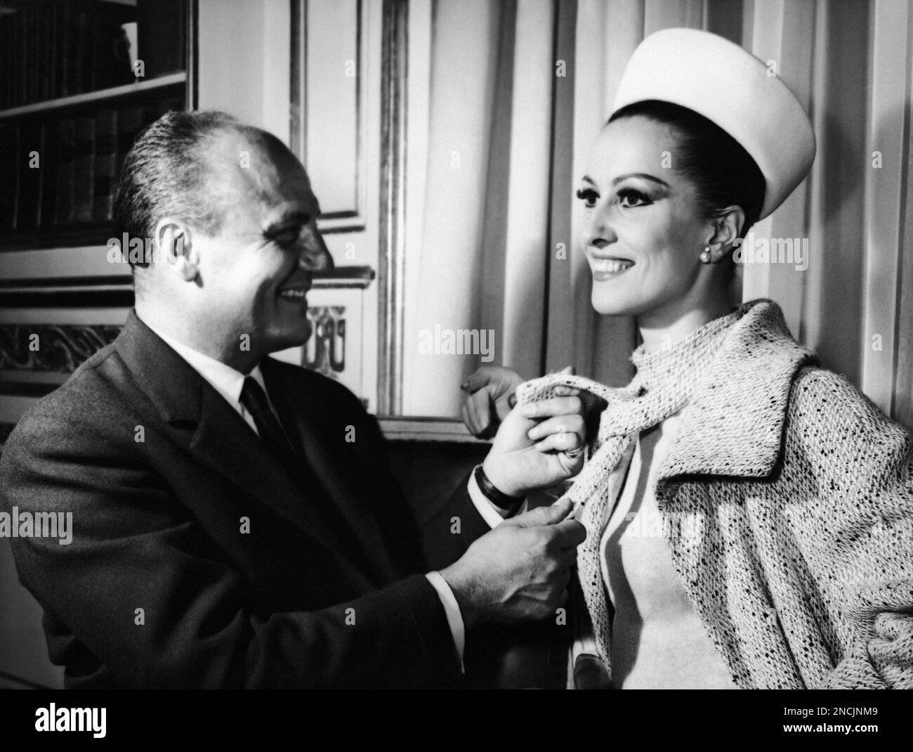 French fashion designer Pierre Balmain and his top model Marina smile ...