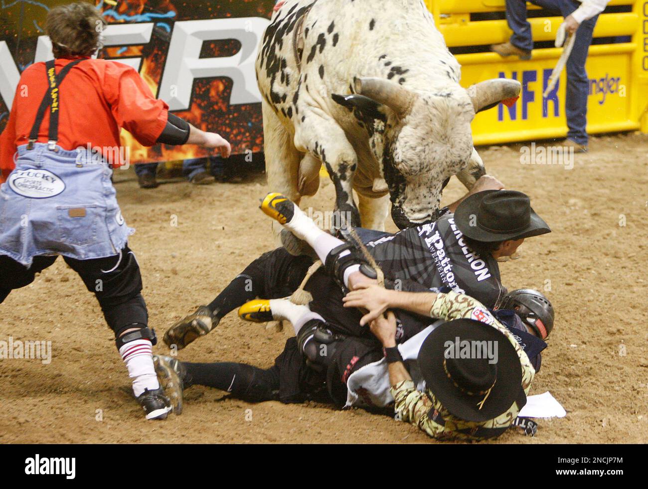 Bucking bull Cajun Monkey goes after bull fighters during the first go ...