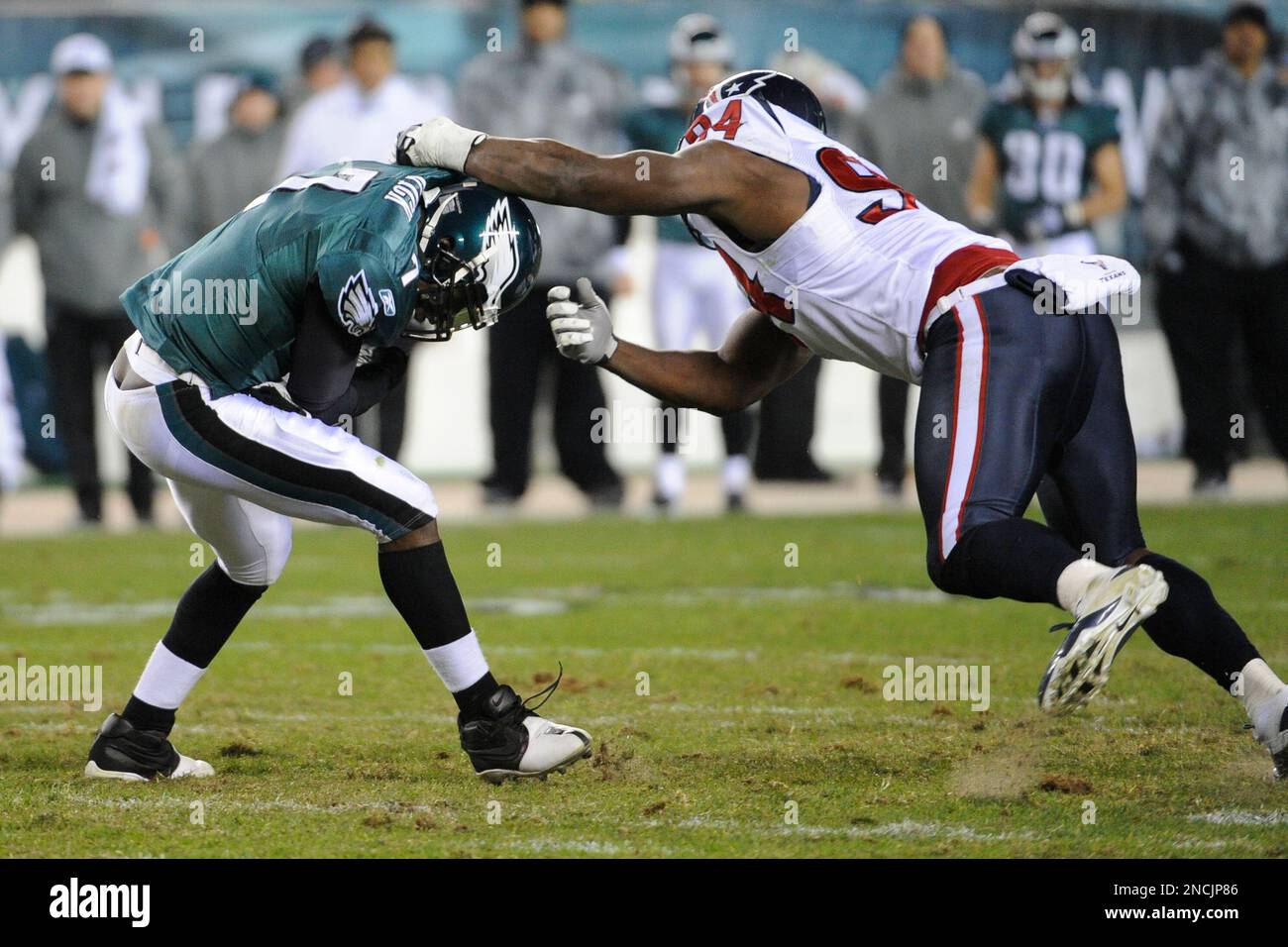 Philadelphia Eagles' Michael Vick shakes off a tackle by Houston Texans ...
