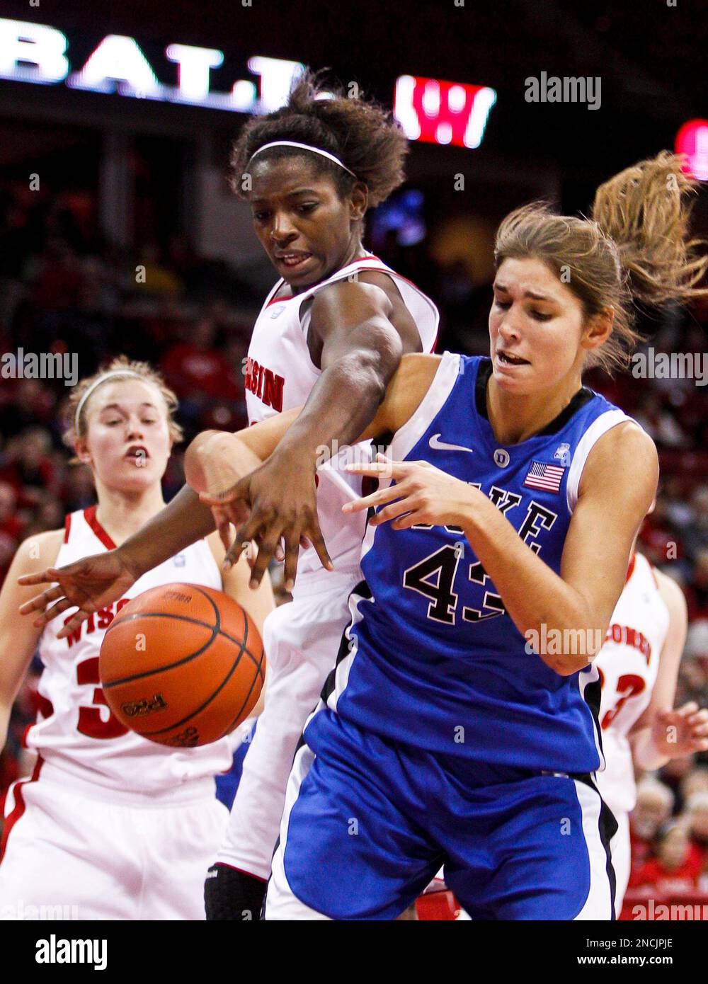 Wisconsin's Anya Covington, left, and Duke's Allison Vernerey (43) go ...