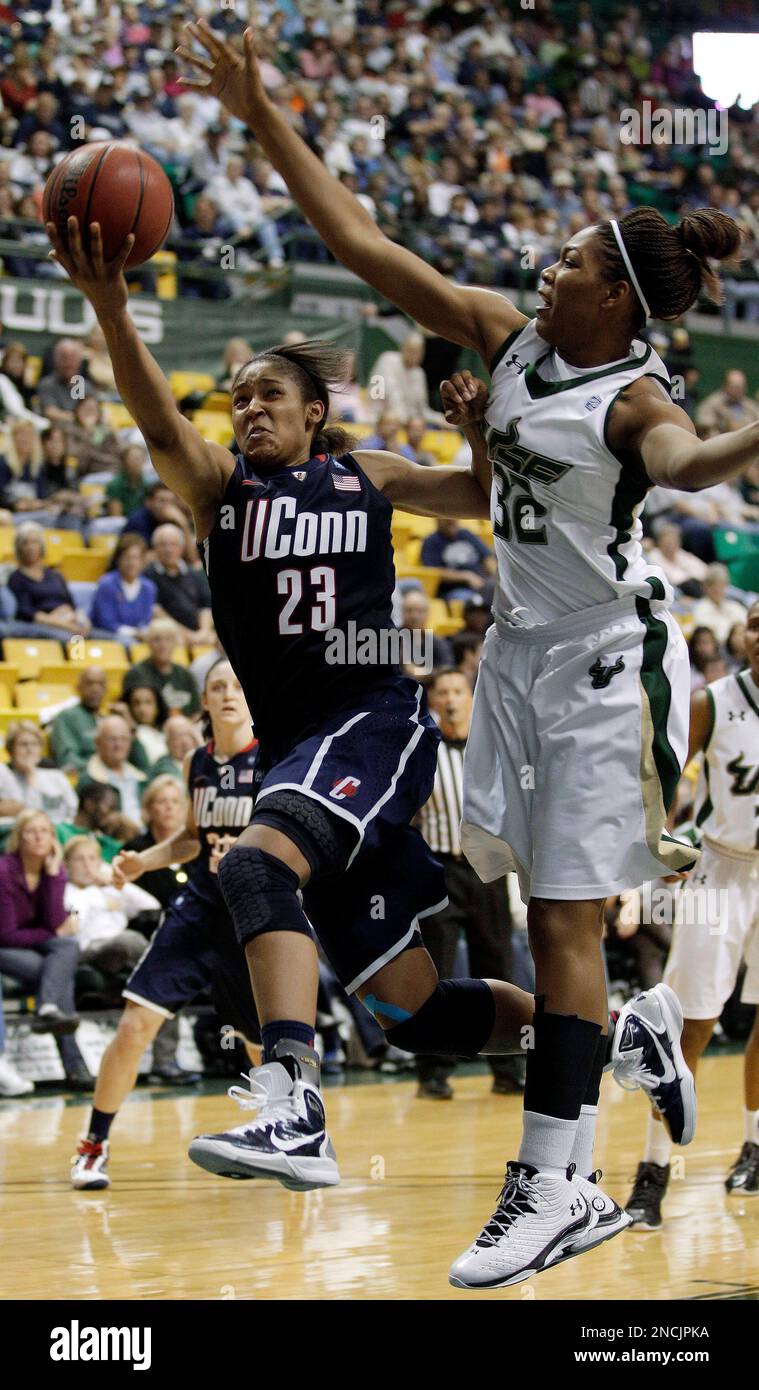 Connecticut's Maya Moore (23) shoots around South Florida's Akila ...