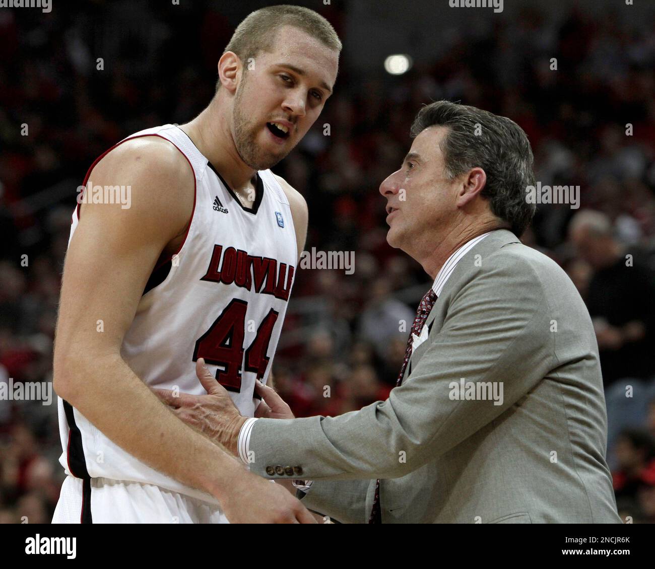 Louisville coach Rick Pitino, right, talks with forward Stephan Van ...