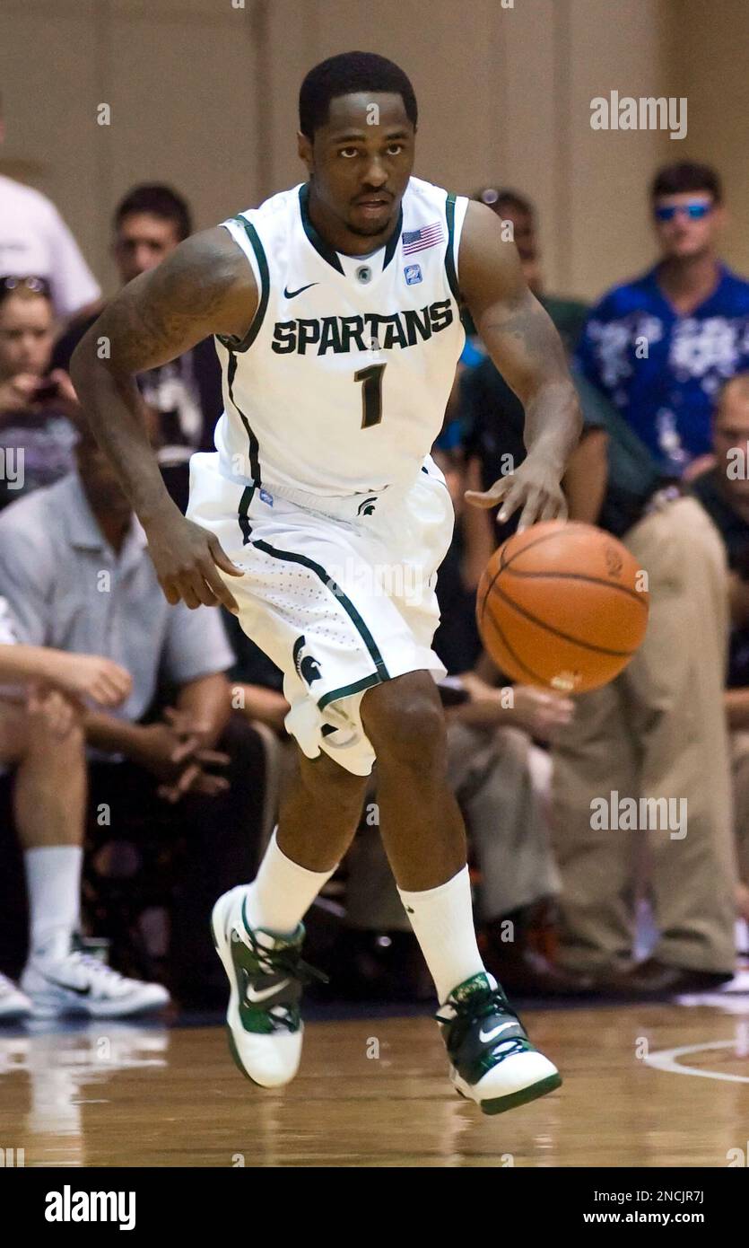 Michigan State guard Kalin Lucas (1) dribbles the basketball up court ...