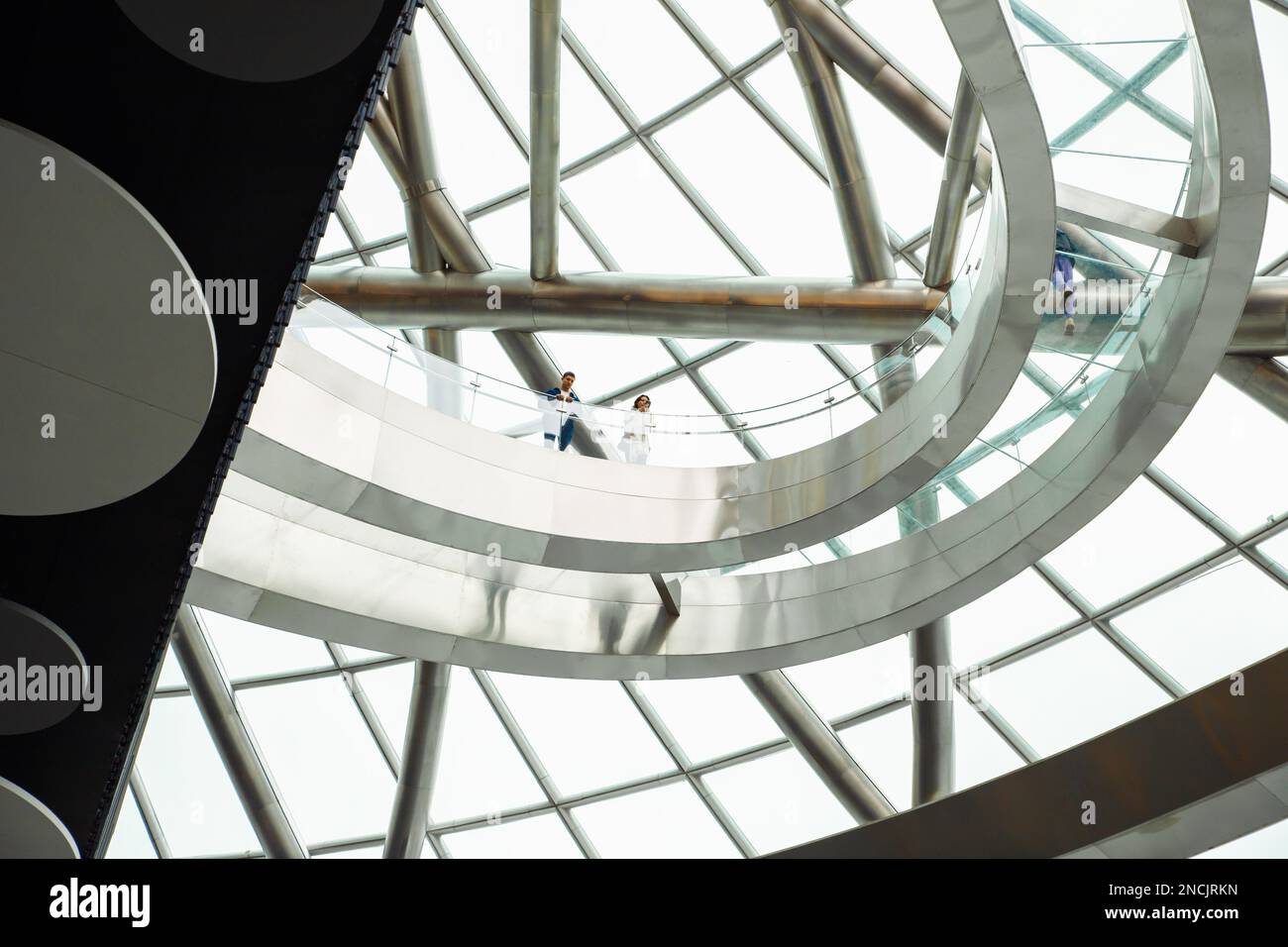 Glass bridge inside Nur-Alem sphere in EXPO 2017, people in glass ...