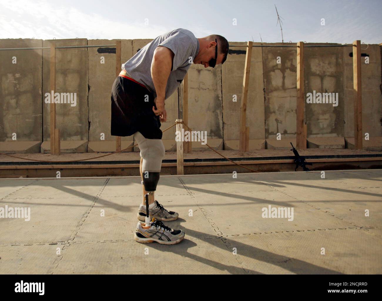 U.S. Army Maj. David Rozelle stretches between push-ups and sit-ups in ...