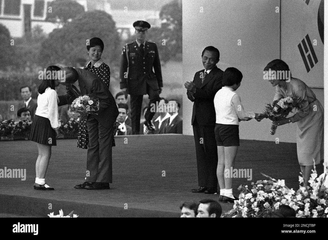 U.S. President Jimmy Carter leans over to kiss Yoo Jae-Eun as first ...