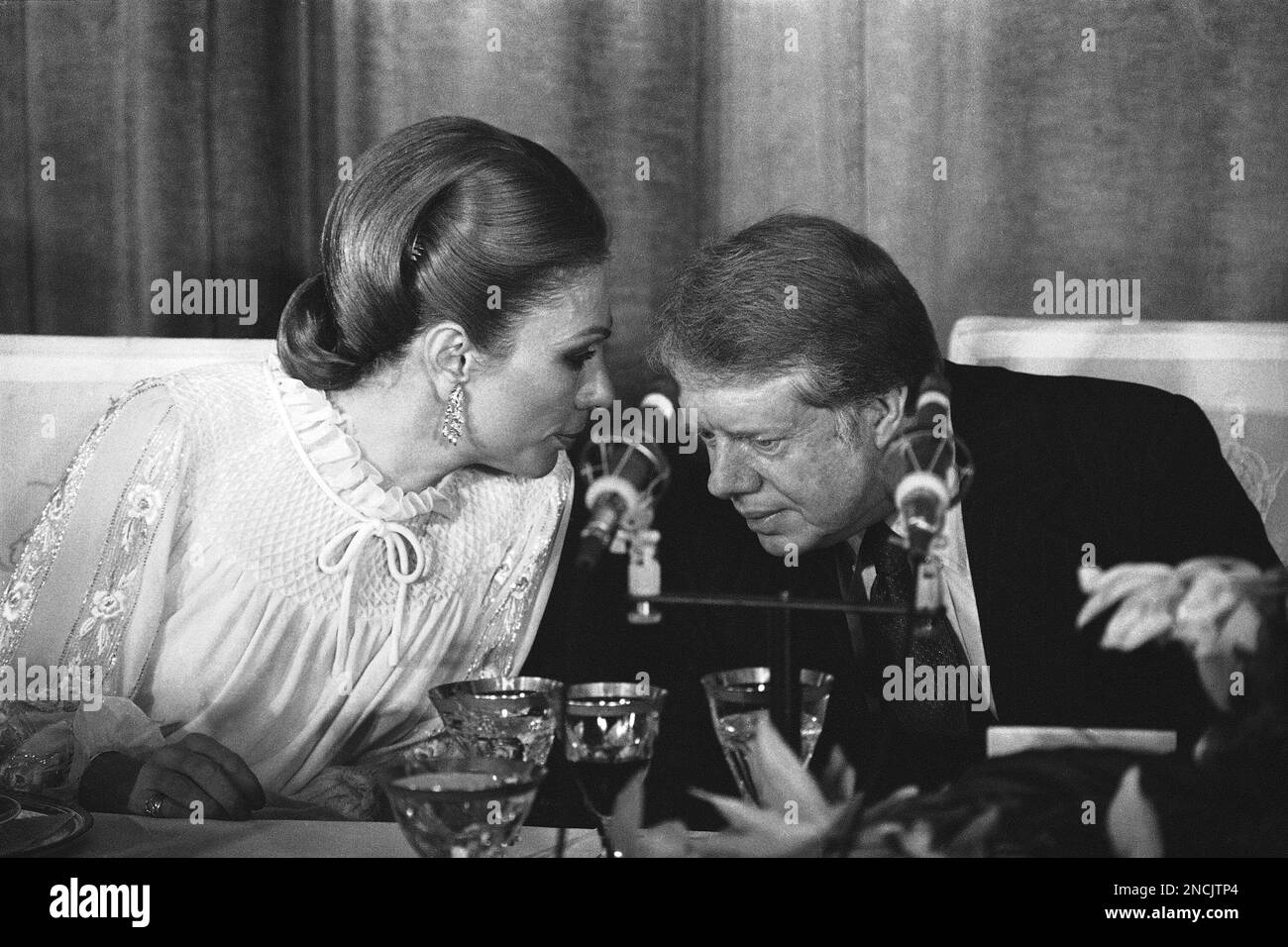 President Jimmy Carter and Empress Farah Diba of Iran chat during New ...