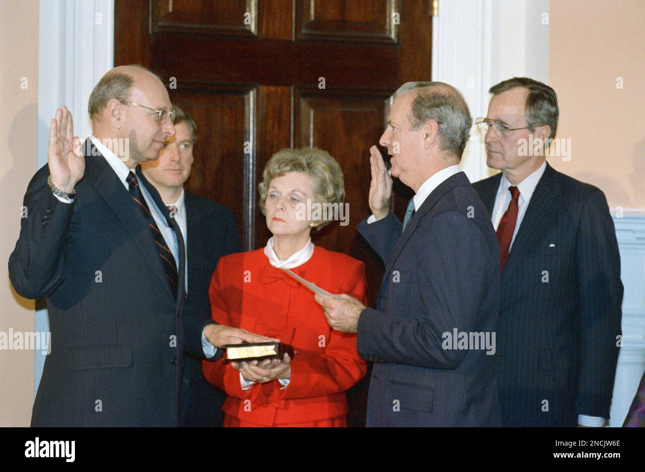 Thomas Pickering, left, is sworn-in by Secretary of State James Baker ...