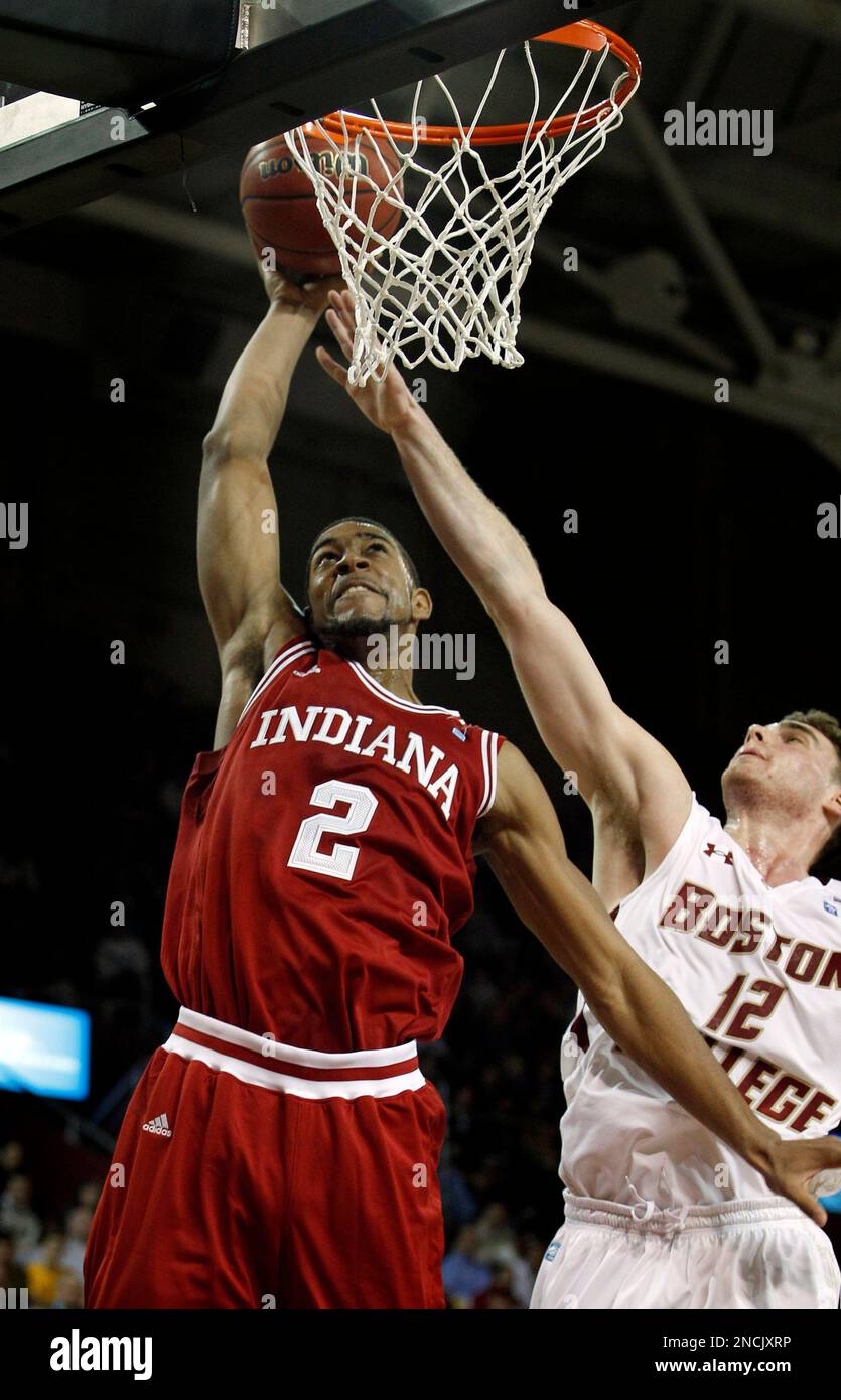 Indiana's Christian Watford (2) goes to the basket ahead of Boston ...