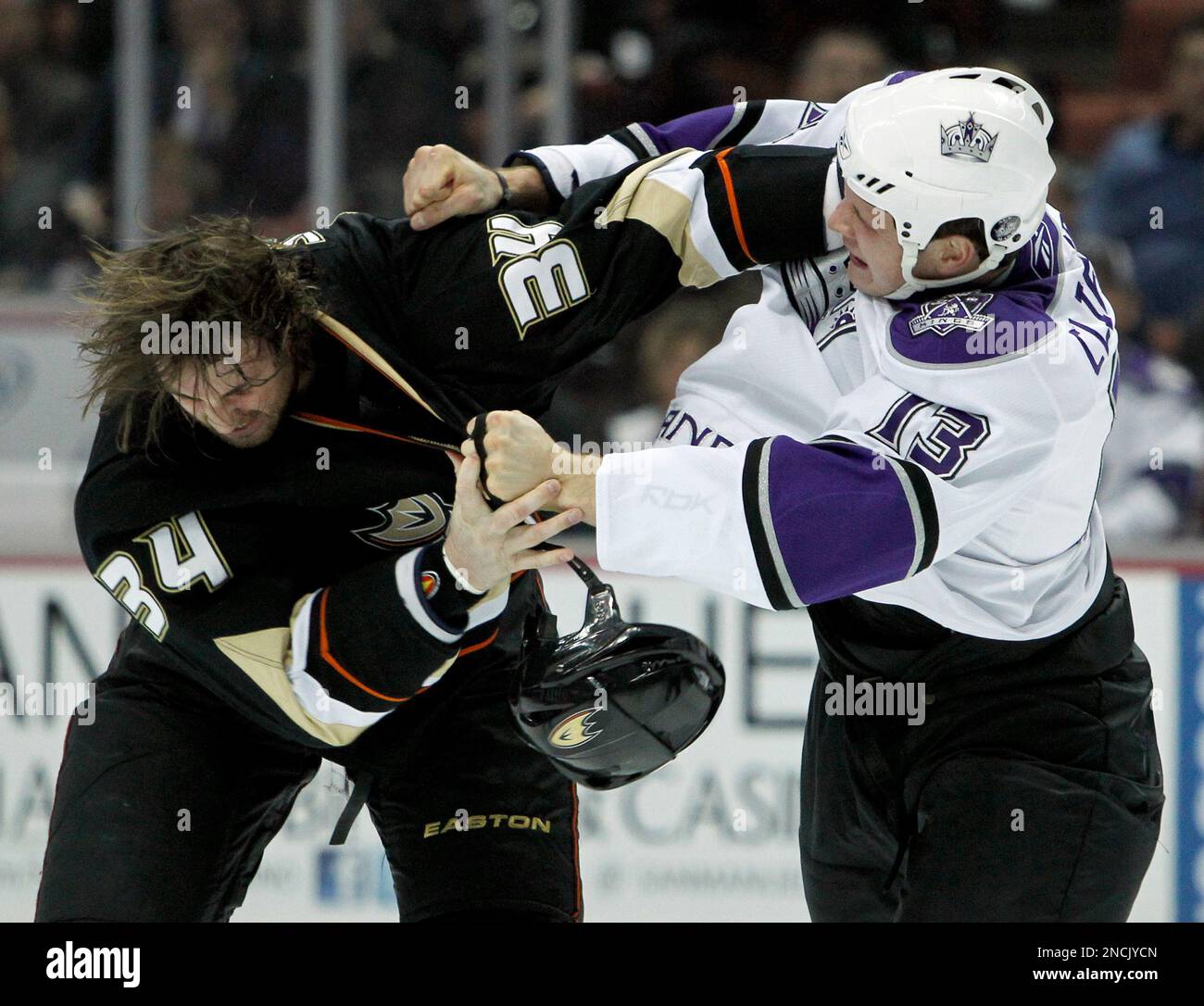 Anaheim Ducks left wing Aaron Voros, left, fights against Los Angeles ...
