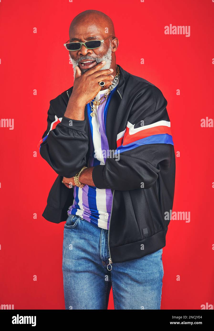 Hes the OG around here. Studio shot of a senior man wearing retro ...