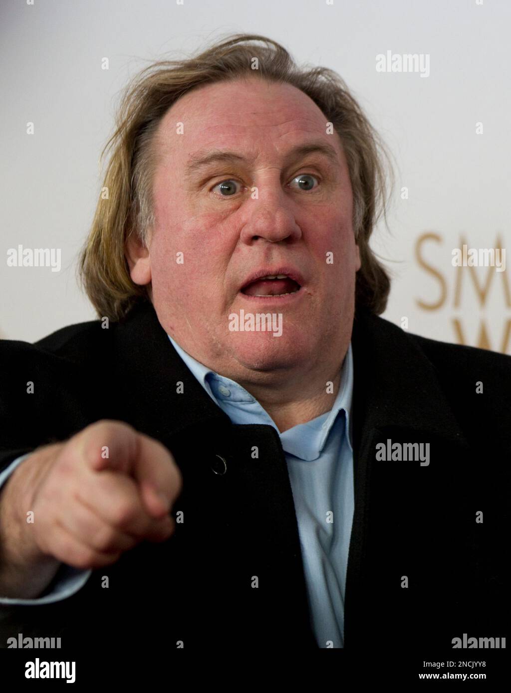 French actor Gerard Depardieu gestures as he arrives for the Premiere ...