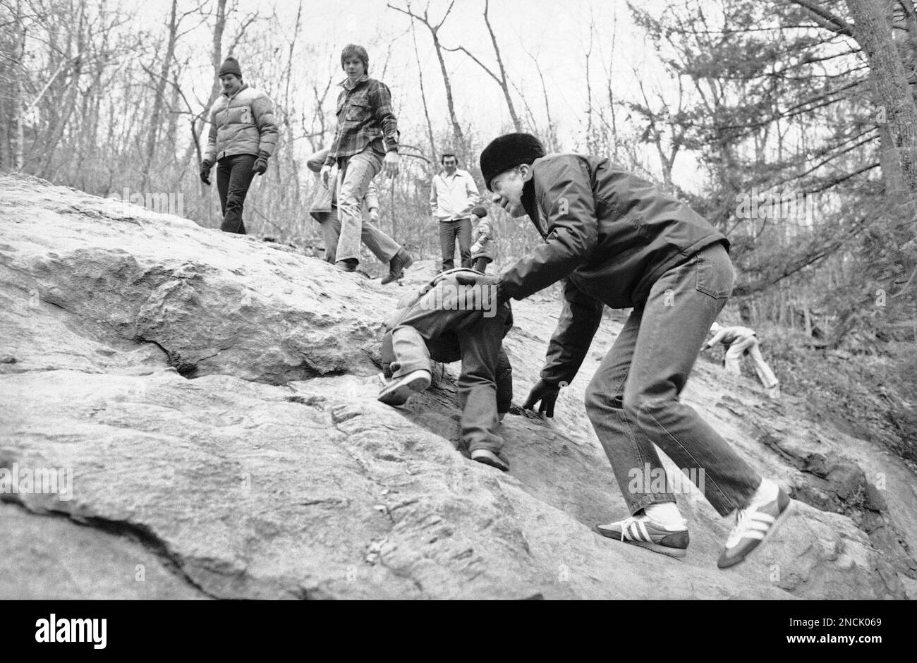 Grandson Jason is helped up the rocks by President Jimmy Carter at ...