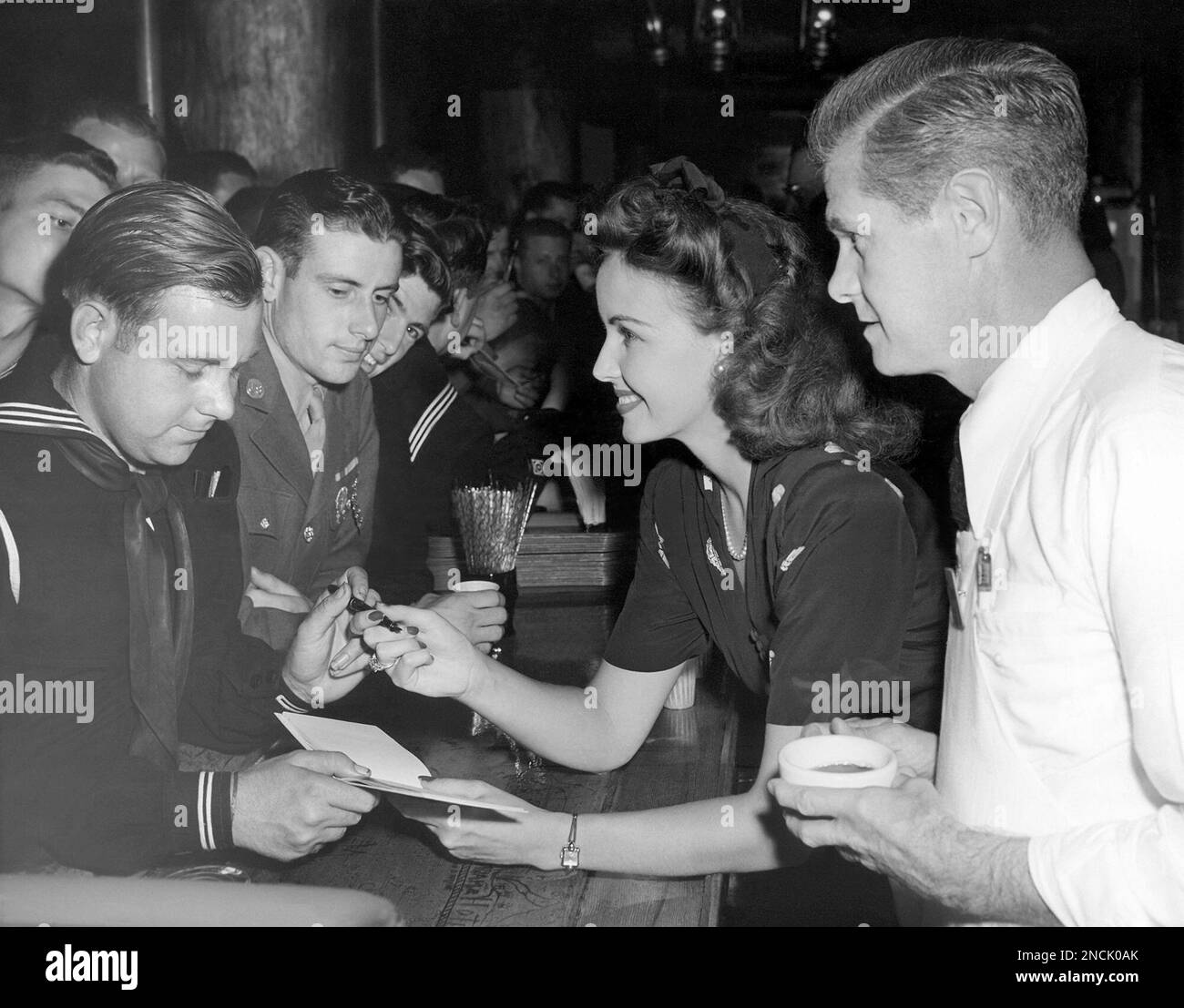 The tables are turned as servicemen are serviced with drinks and ...