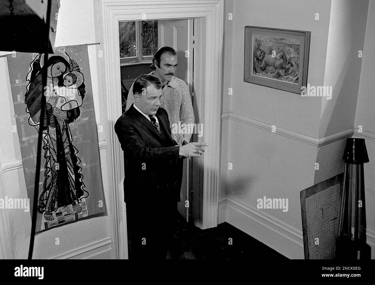 Drooping mustache and long hair in back have transformed Agent 007 ...