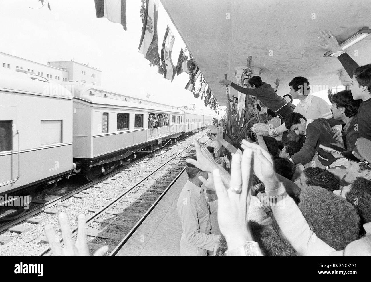 President Jimmy Carter waves from a train as he passes through the ...