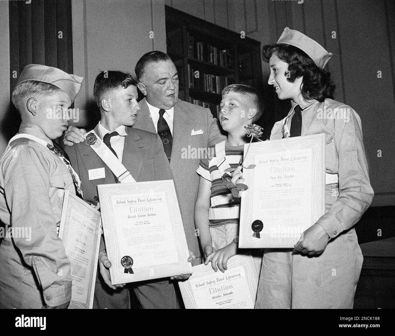 Holding citations earned for saving the lives of their schoolmates in ...