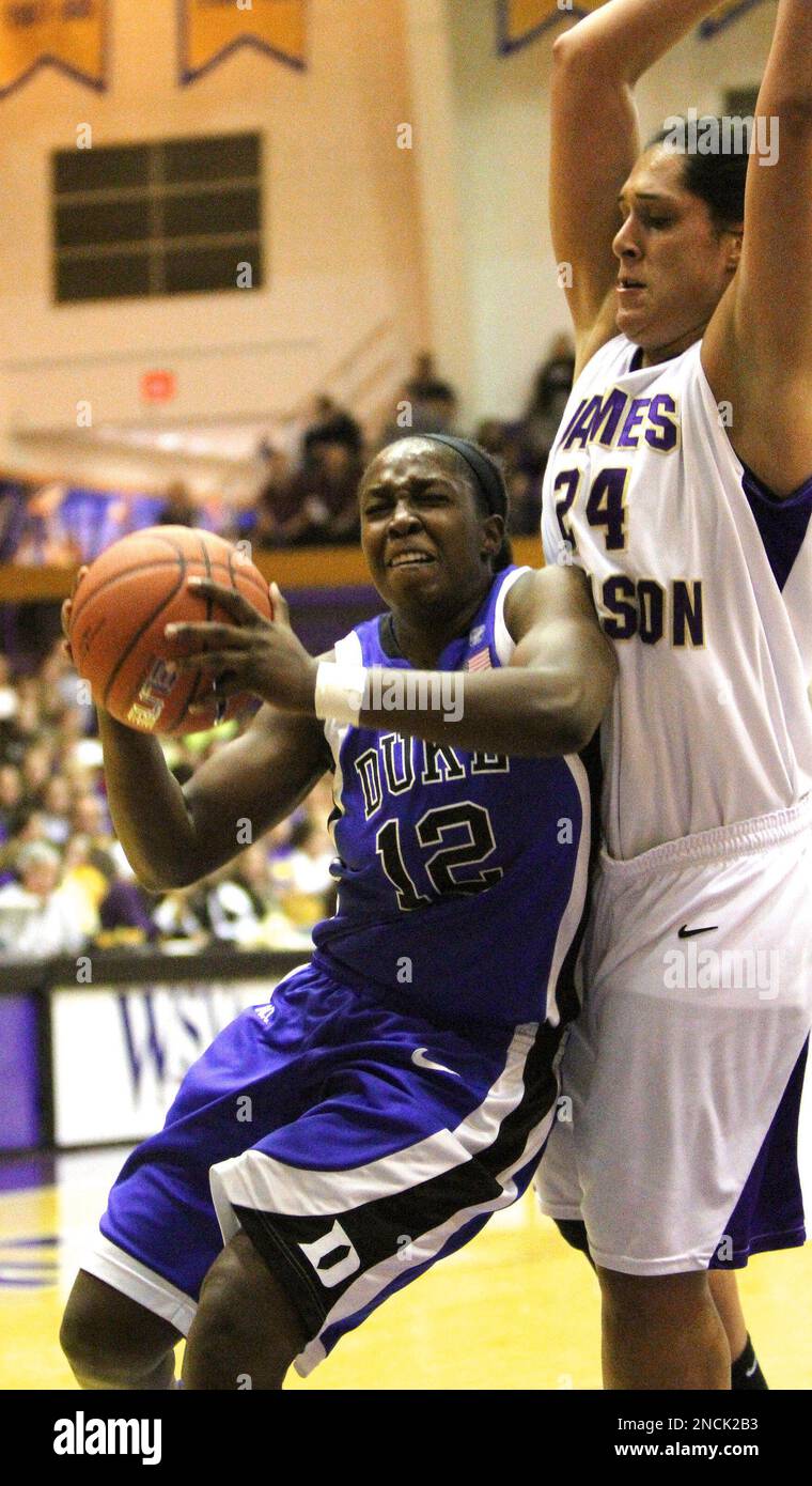 Duke's Chelsea Gray (12) drives against James Madison's Lauren Jimenez ...