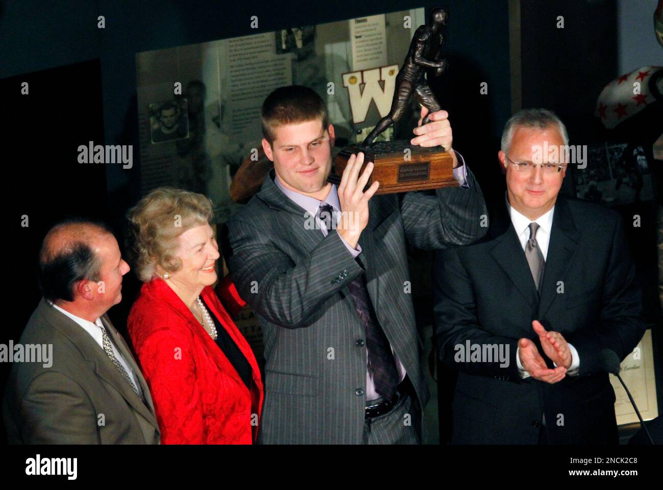 Mississippi State linebacker Chris White hoists the Conerly Trophy ...
