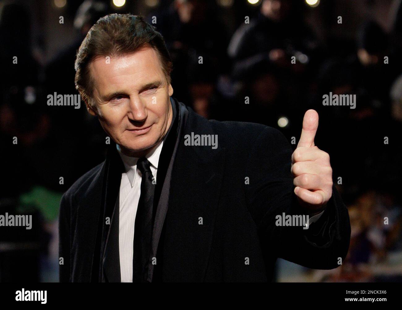 Irish actor Liam Neeson gestures as he arrives for the World premiere ...