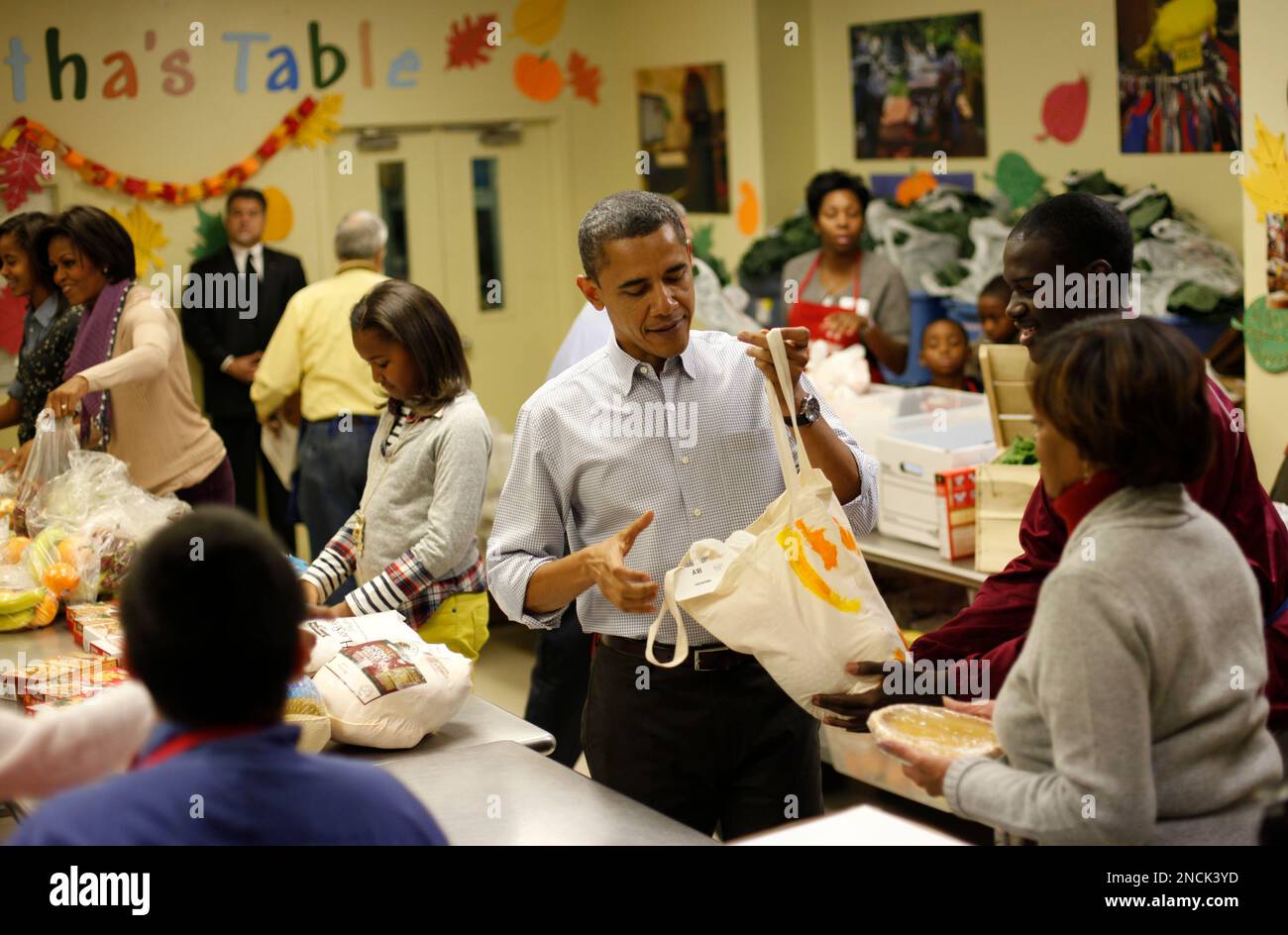President Barack Obama, center, with members of his family, as they ...