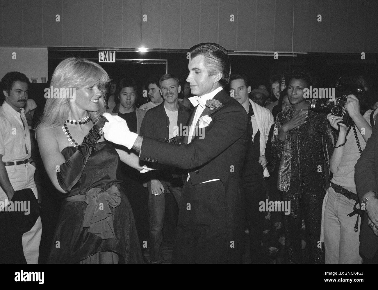 Actress Liz Treadwell keeps actor George Hamilton at arm’s length as ...