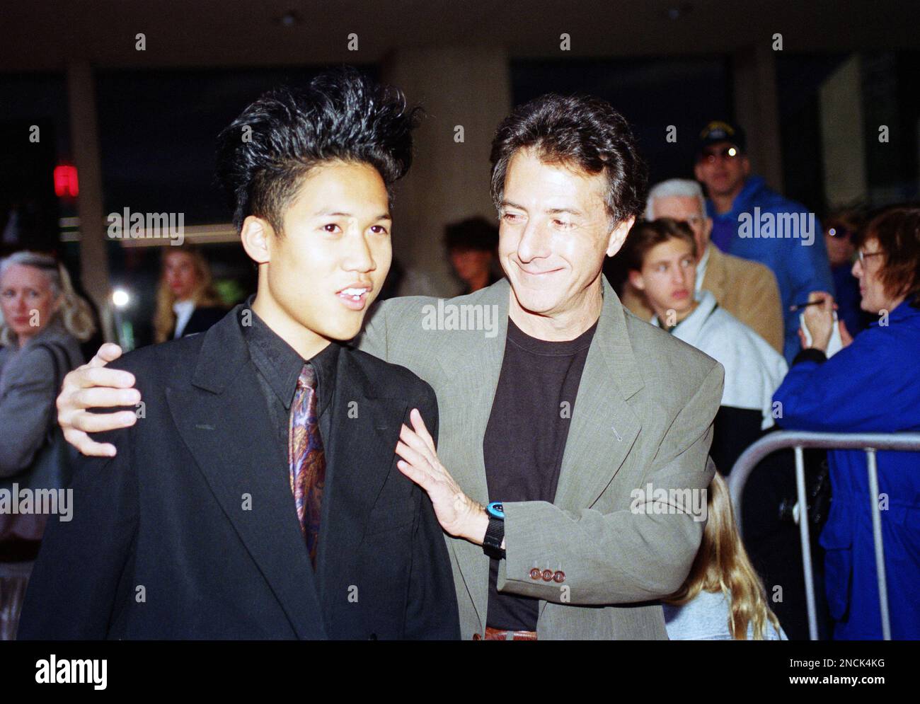 Dustin Hoffman, right, grabs Dante Basco as they arrive for the ...