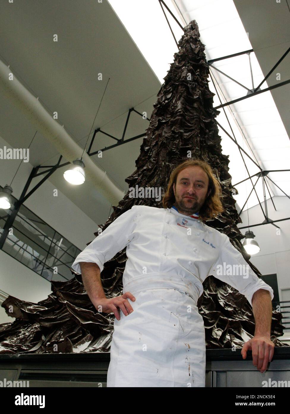 French chocolate maker Patrick Roger poses next to his new creation, a ...