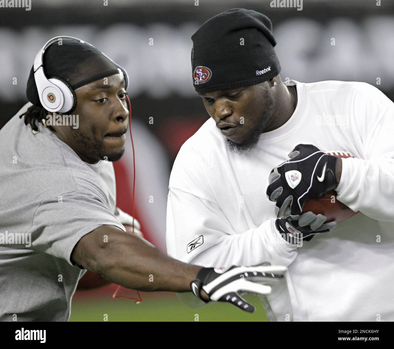 San Francisco 49ers defensive tackle Ricky Jean-Francois, left, warms ...