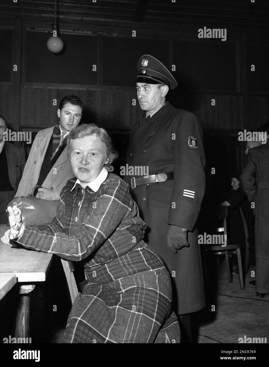 A German police guard stands by Ilse Koch, “The Red Witch of Buchenwald ...