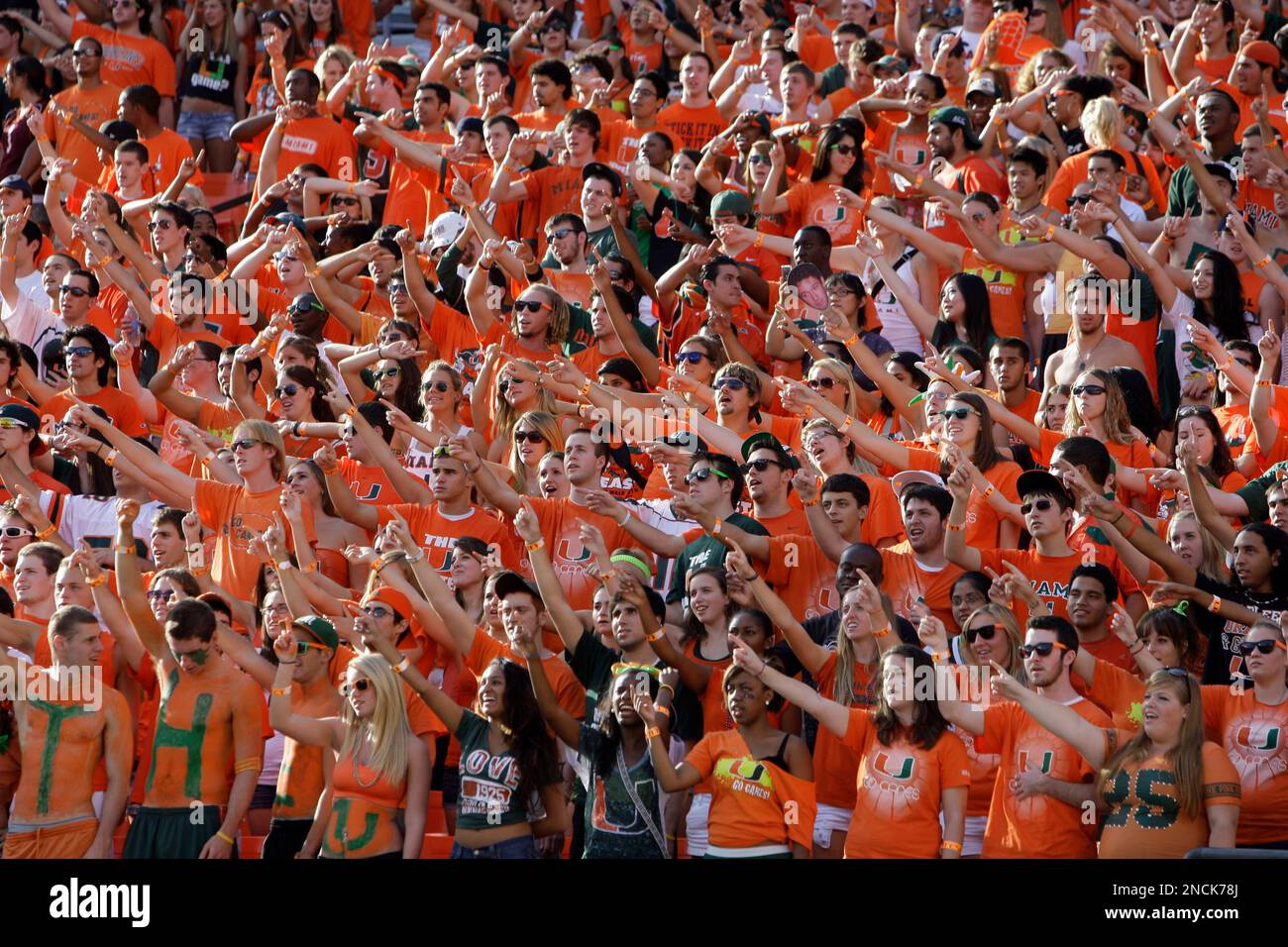 Miami fans sing their alma mater during an NCAA college football game ...