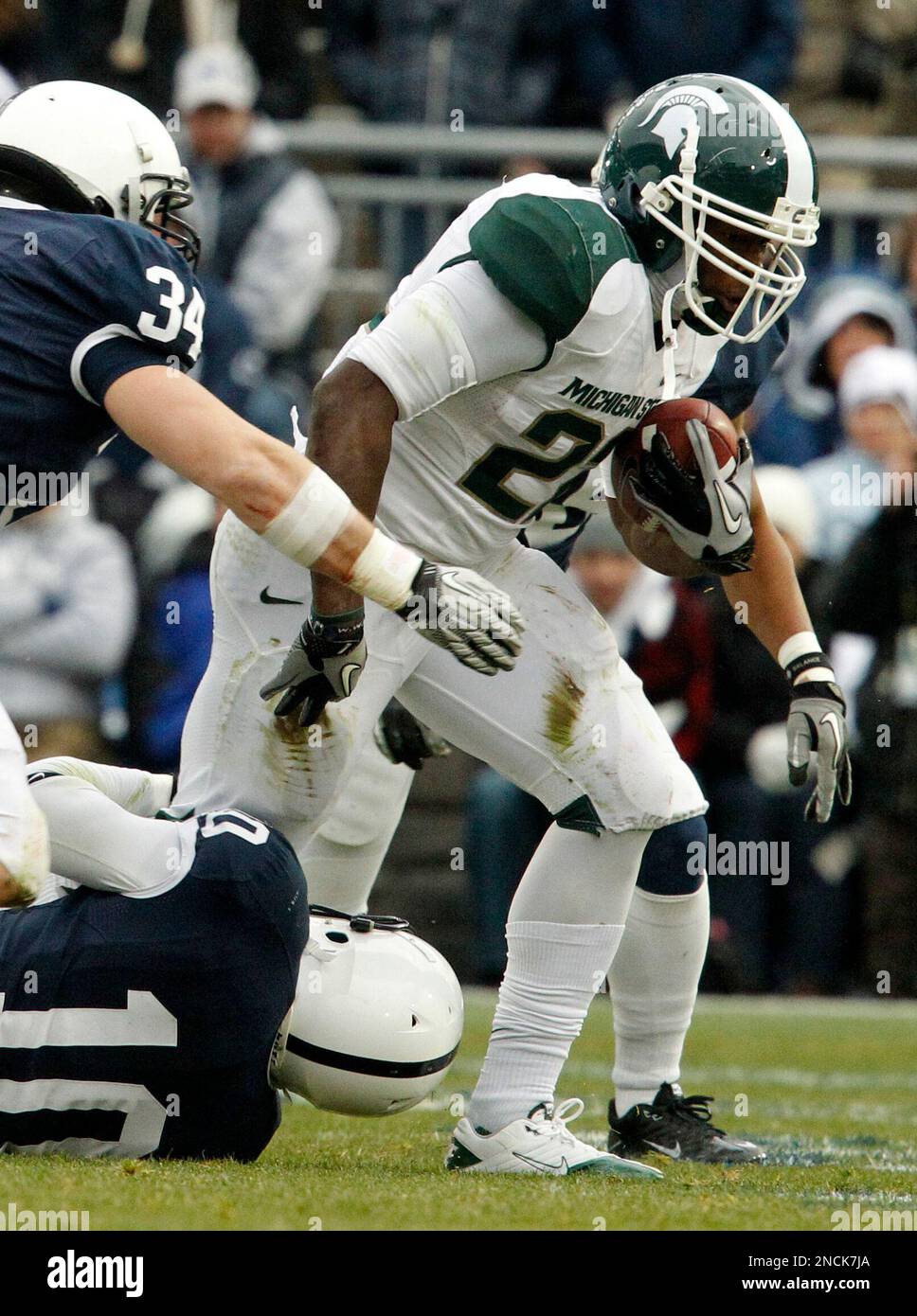 Michigan State running back Larry Caper, right, runs past Penn State ...