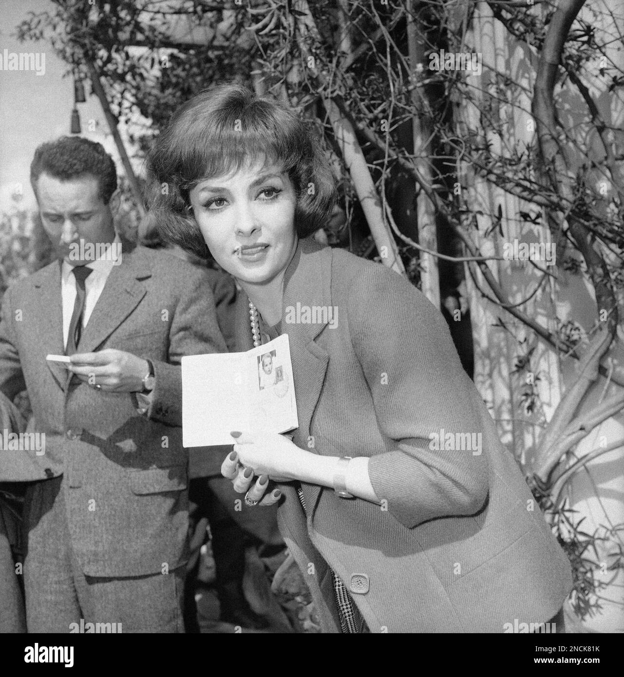 Italian movie star Gina Lollobrigida shows the “stateless” passport of ...