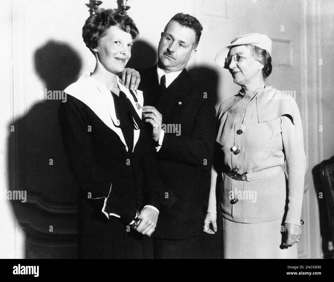Dr. Giuseppe Castruccio, center, Italian consul general in Chicago, is ...
