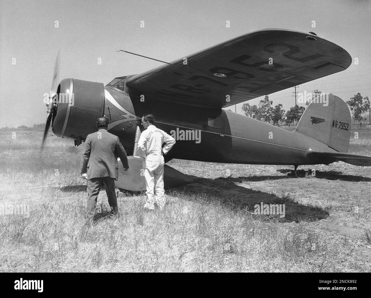 Amelia Earhart Putnam in her Lockheed Vega plane in which she was the ...
