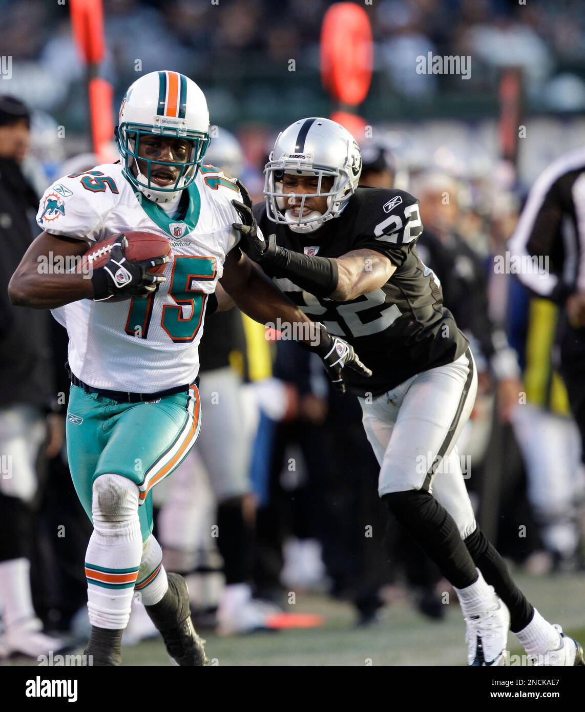 Miami Dolphins wide receiver Davone Bess (15) and Oakland Raiders ...