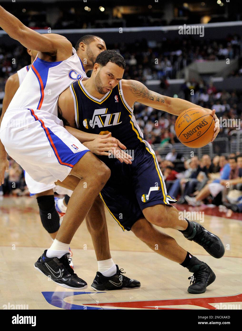 Utah Jazz guard Deron Williams, right, moves past Los Angeles Clippers ...