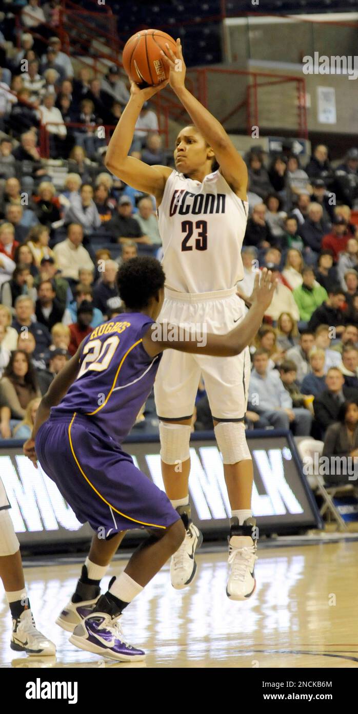 Connecticut's Maya Moore takes a jump shot over LSU's Destini Hughes in ...