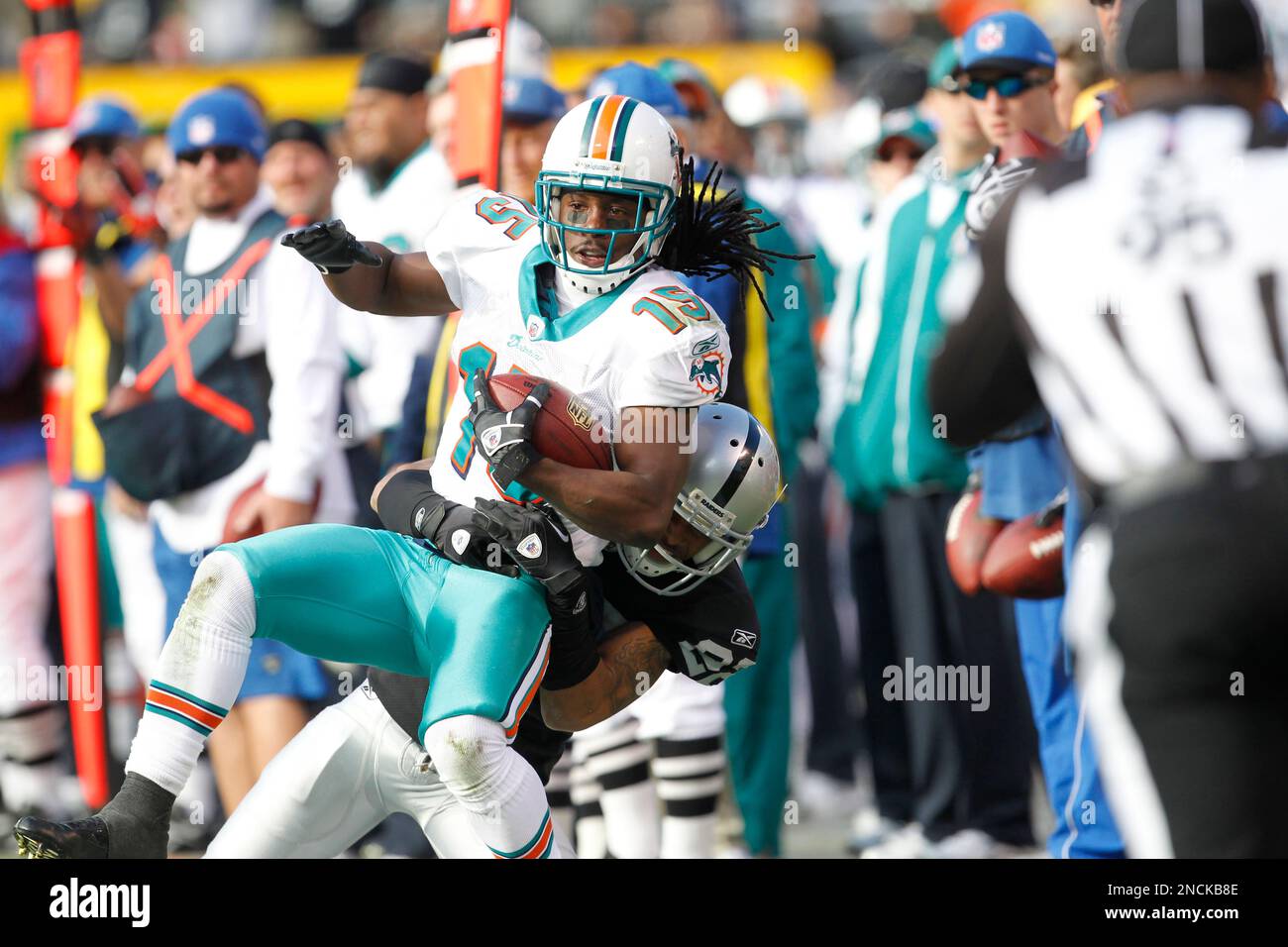Miami Dolphins wide receiver Davone Bess (15) and Oakland Raiders ...