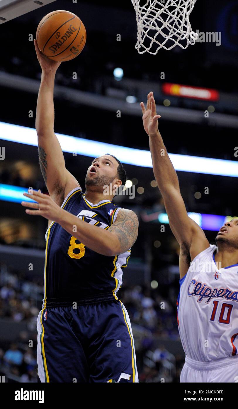 Utah Jazz guard Deron Williams, left, puts up a shot as Los Angeles ...
