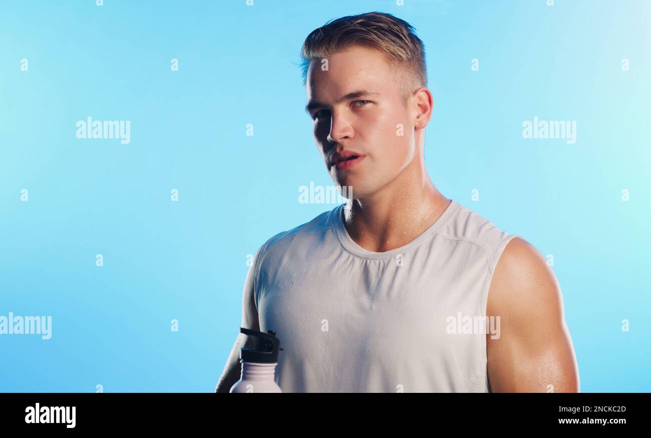 Keep yourself hydrated. Studio portrait of a handsome young man posing ...