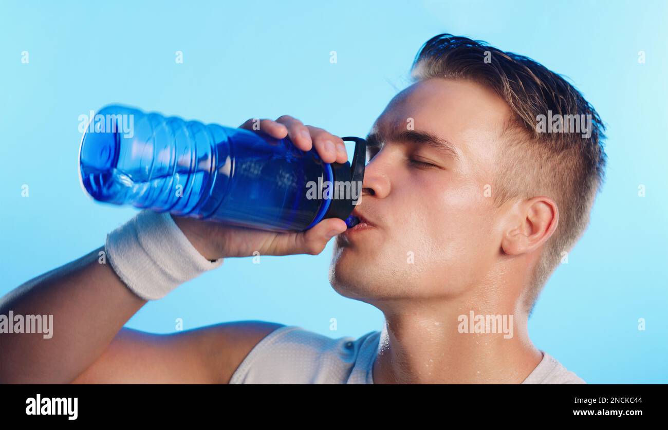 Take care to stay hydrated. Studio shot of a handsome young man ...