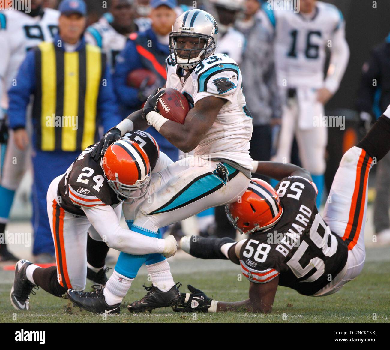 Carolina Panthers running back Mike Goodson (33) is wrapped up by ...