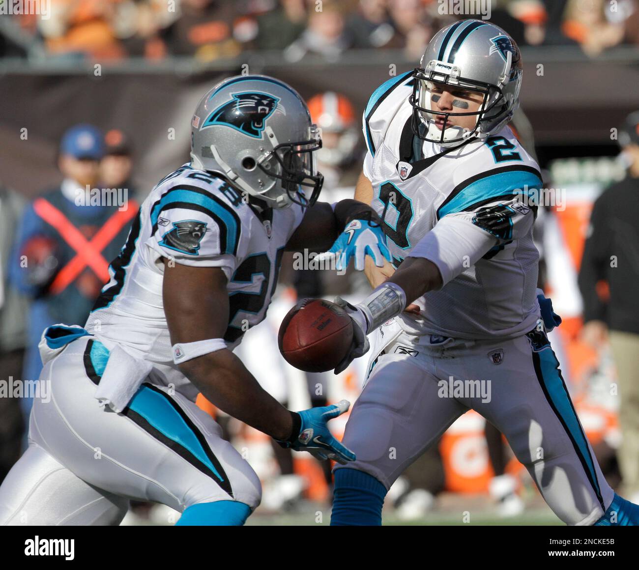 Carolina Panthers quarterback Jimmy Clausen (2) hands off to running ...