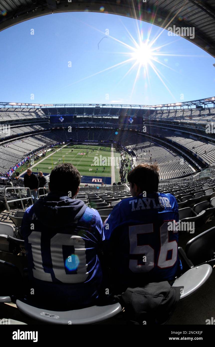 Two fans show up early before the NFL football game between the ...