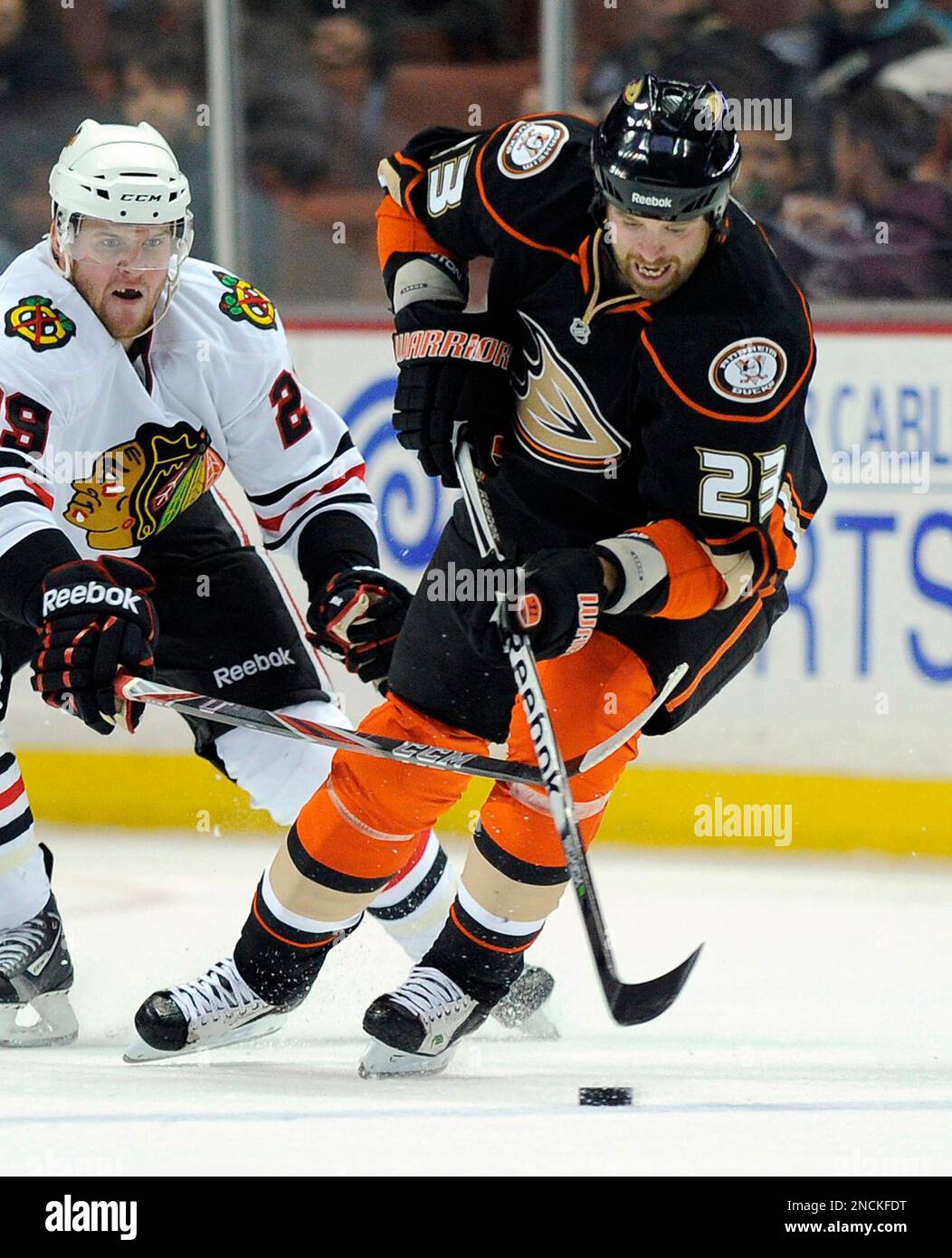 Anaheim Ducks defenseman Paul Mara, right, controls the puck as Chicago ...