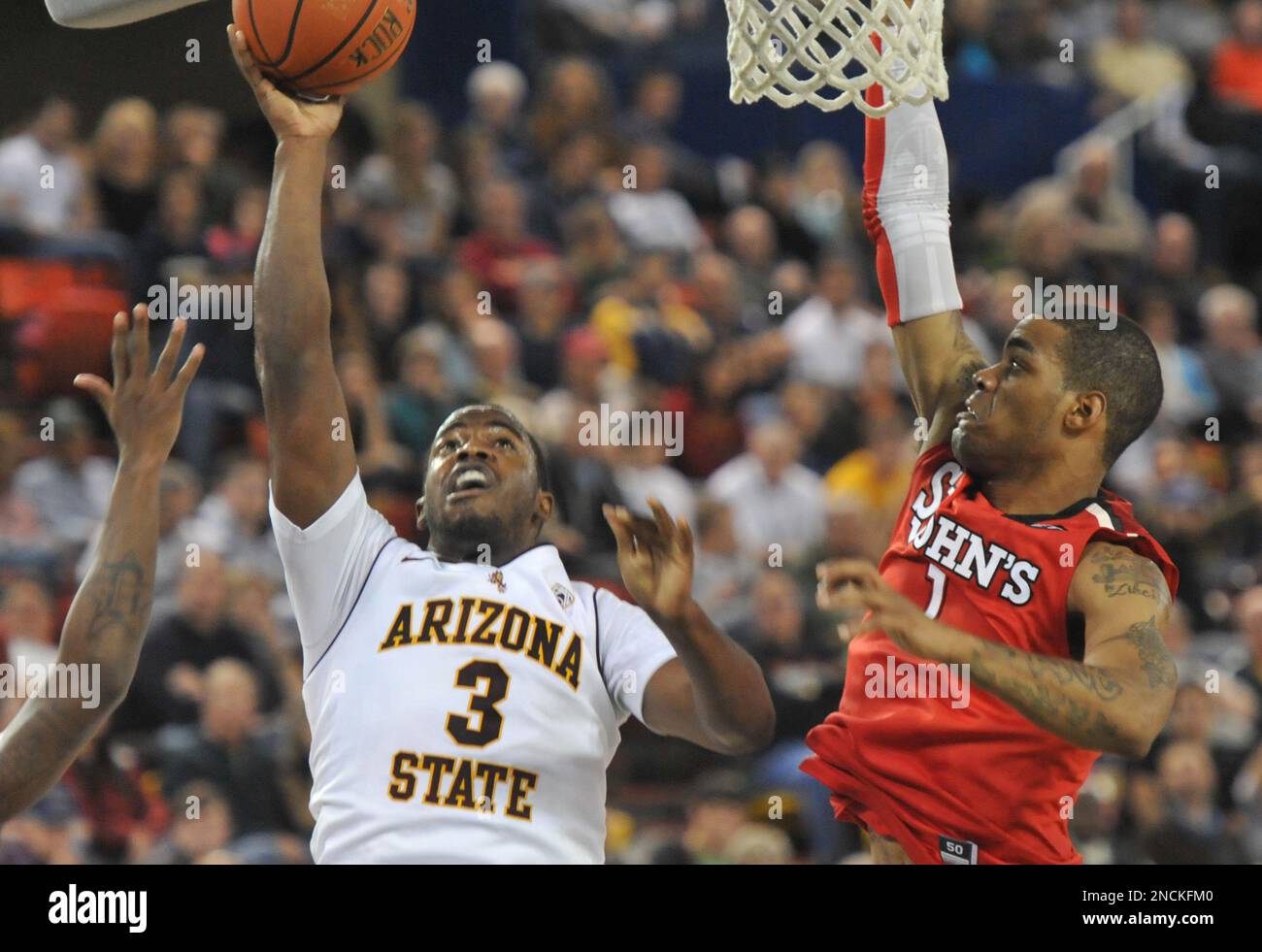 Arizona State's Ty Abbott (3), goes up for a shot against the defense ...