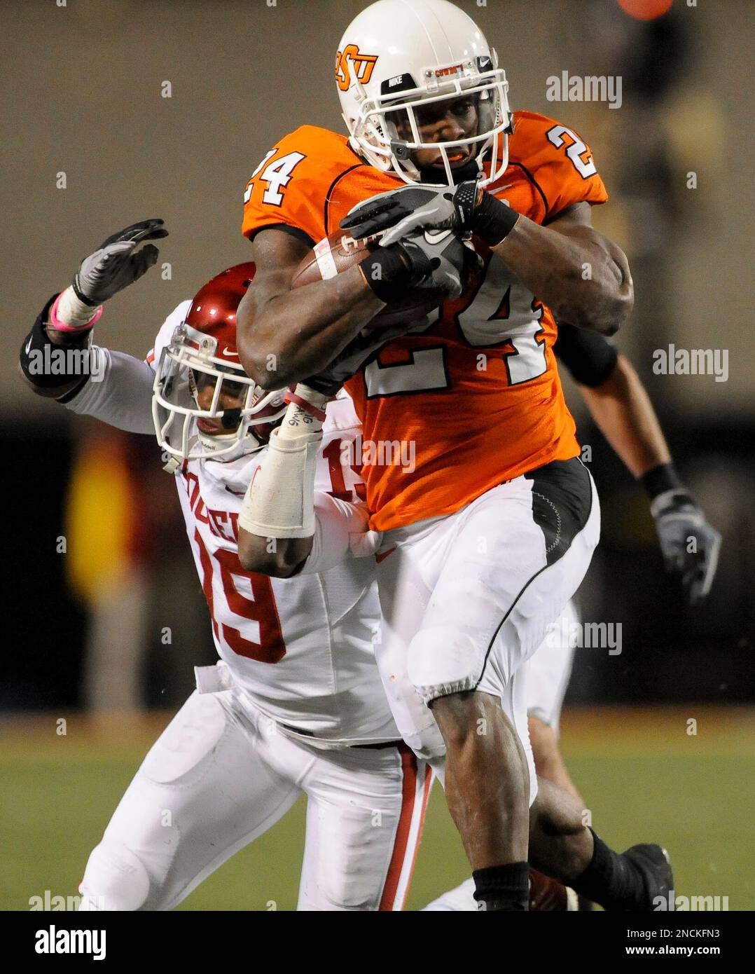 Oklahoma defensive back Demontre Hurst, left, reaches for Oklahoma ...