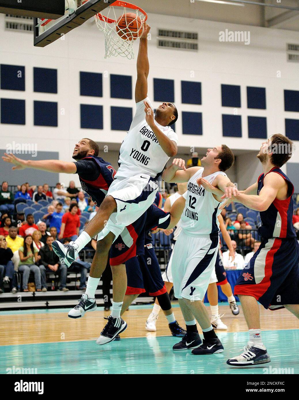 BYU forward Brandon Davies (0) dunks the ball off a rebound against ...