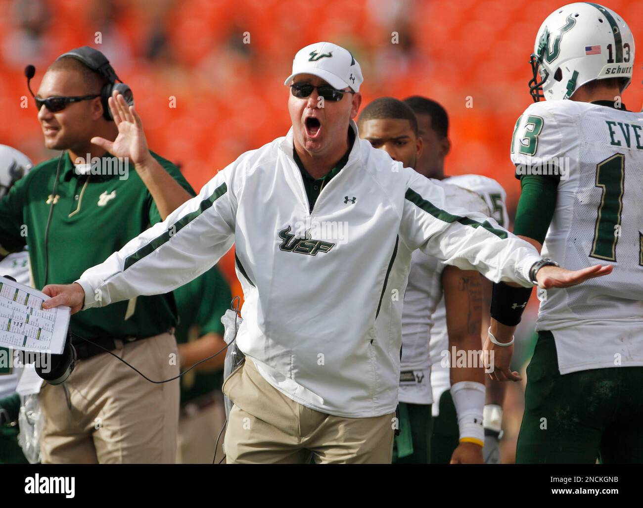 South Florida coach Skip Holtz, center, protests a penalty call during ...